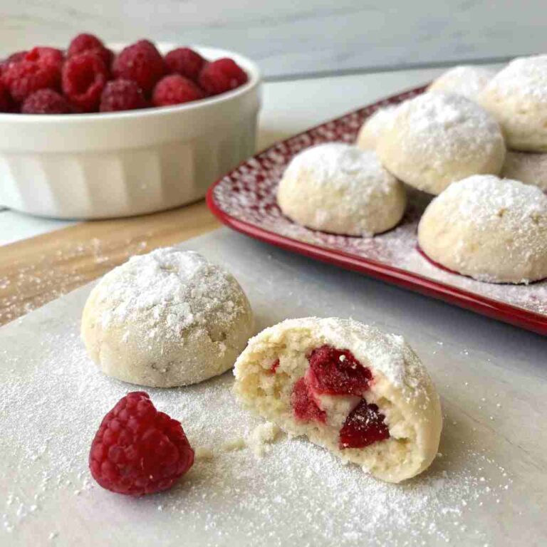 Raspberry-Filled Almond Snowball Cookies - Elegant Holiday Treat